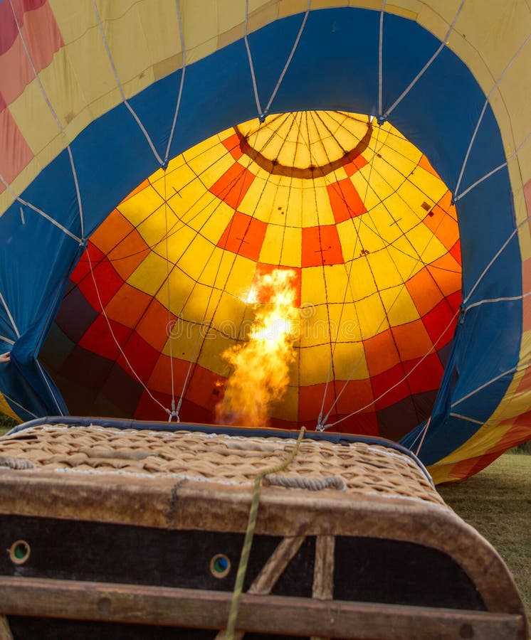 A Hot Air Balloon with a Fire in the Bottom of it Stock Photo - Image ...