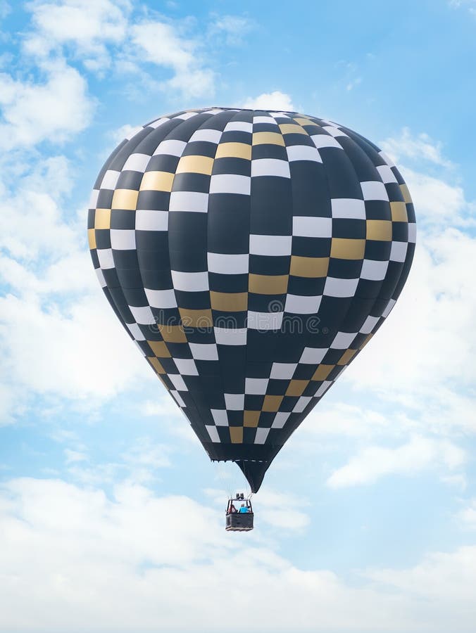 Hot Air Balloon Flying Against the Bright Blue Sky Stock Image - Image ...