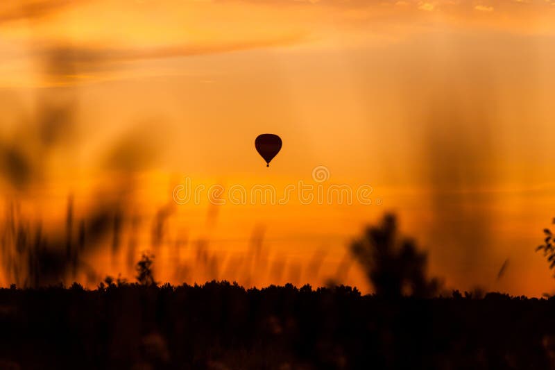 Hot Air Balloon Flying at Sunset Sky Stock Image - Image of dawn, field ...
