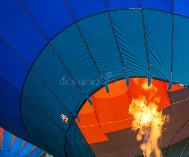 Hot Air Balloon Getting Fired Up To Inflate Stock Photo - Image of fire ...