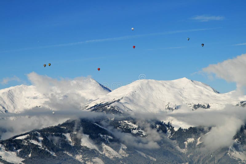 Hot Air Ballooning Over the Tops of Mountains Stock Image - Image of ...