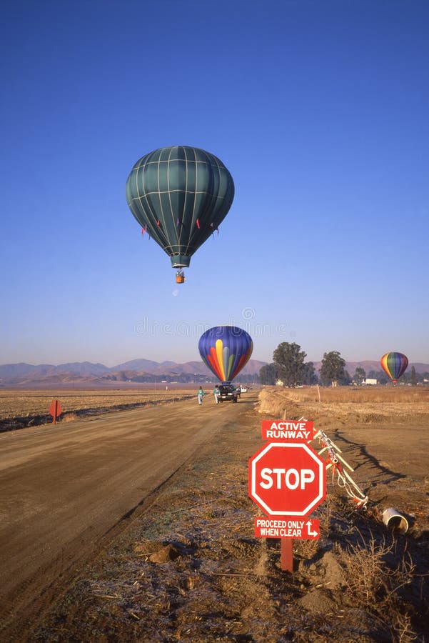 Hot Air Balloons Cross Runway Stock Image - Image of recreation, runway ...
