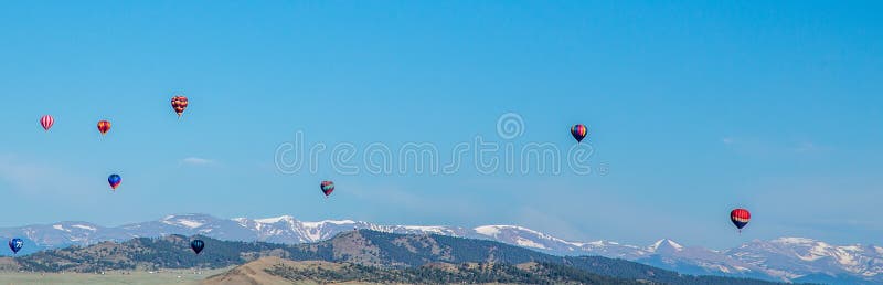 Hot Air Balloons Passing Over Mountains in Colorado Stock Photo - Image ...