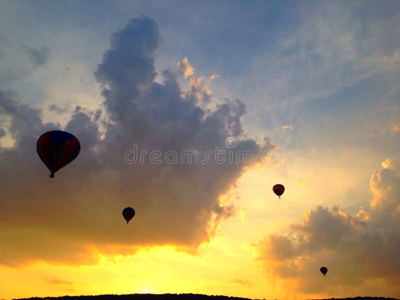 Hot air balloons at sunset stock photo. Image of sunset - 43103650