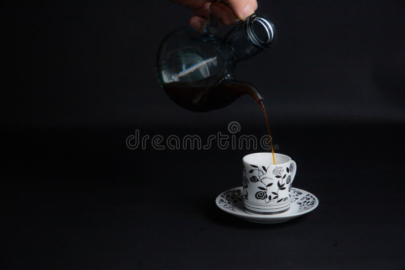 Hot Black Coffee and Coffee Jug Falling on White Porcelain Cup Stock ...