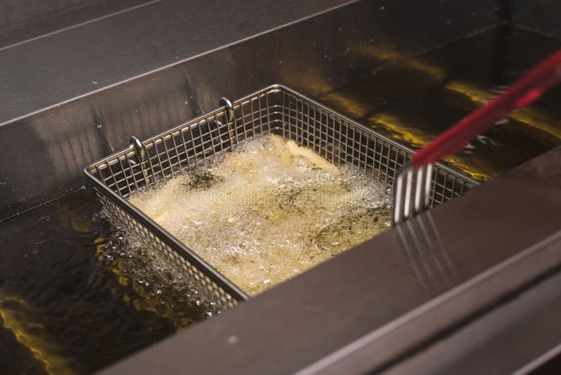 Hot Bubbles of Cooking Oil in a Deep Fryer Stock Photo - Image of ...