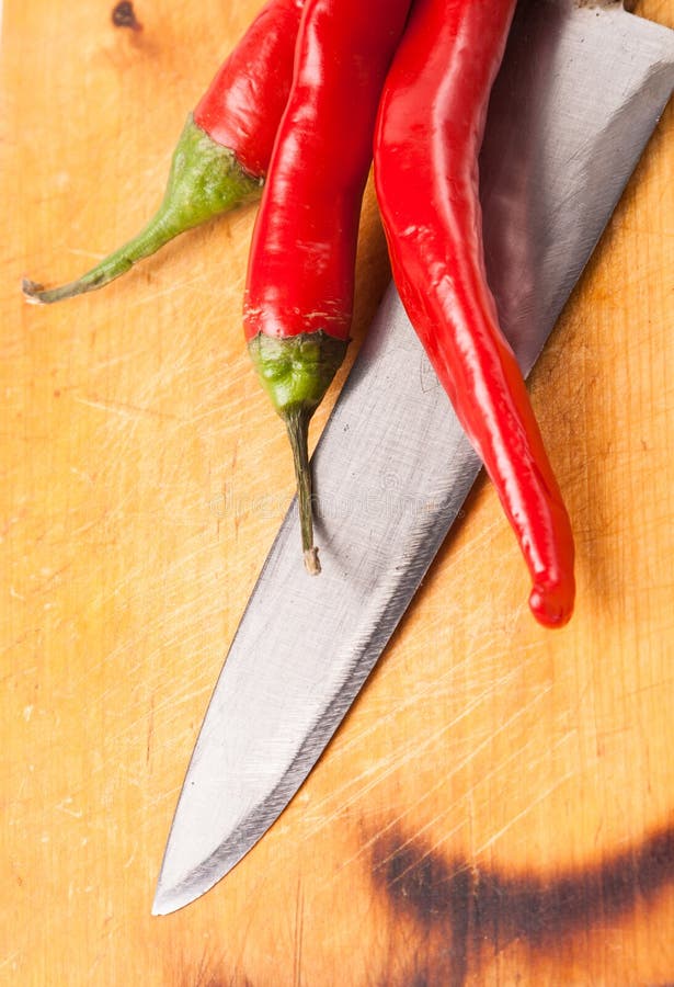 Hot Capsicum Chili Pepper and Knife on Board Stock Image - Image of ...