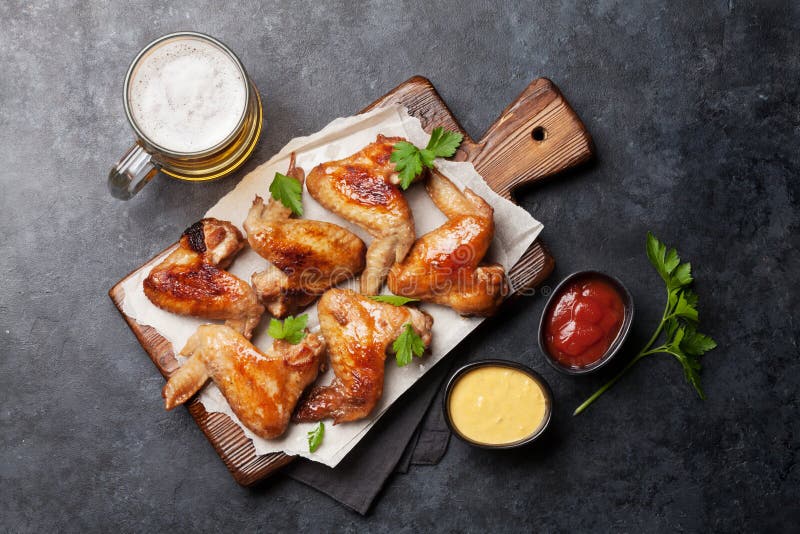 Hot Chicken Wings and Draft Beer Stock Photo - Image of grilled, dish ...