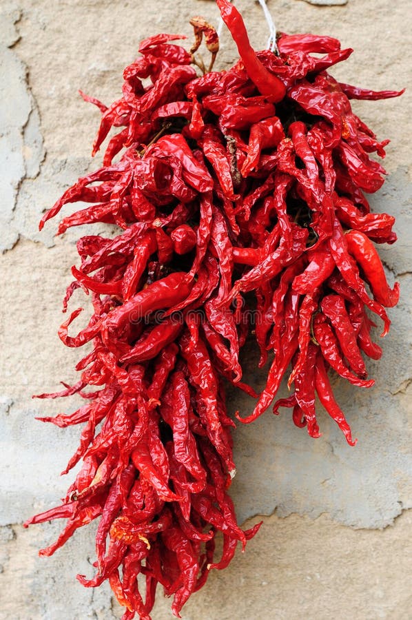 Hanging Strand of Red Chili Peppers Stock Photo - Image of close ...