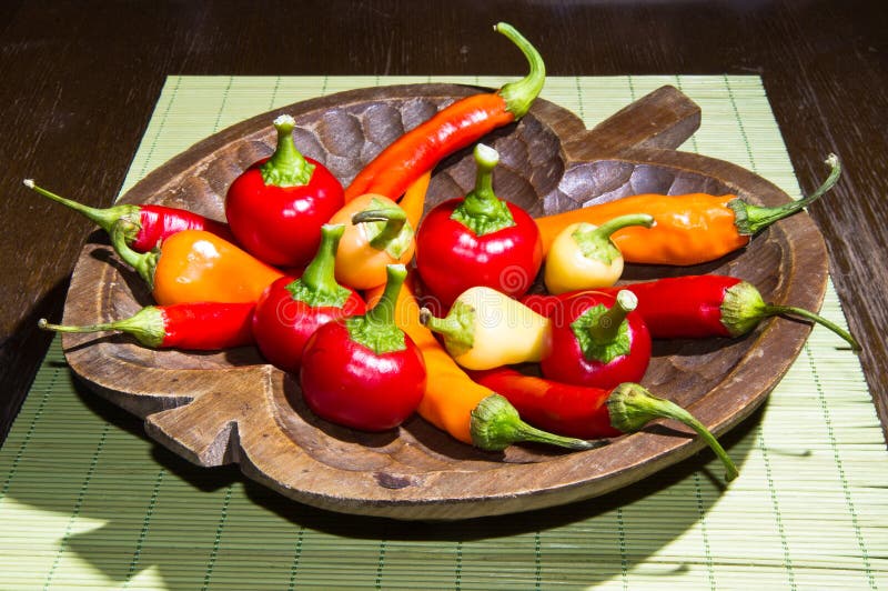 Hot Chilli Pepers on a Wooden Plate Stock Image - Image of dried ...