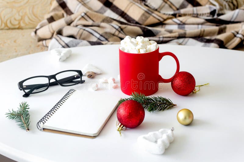 Hot Chocolate with Marshmallows in the Red Cup and Empty Notebook on ...