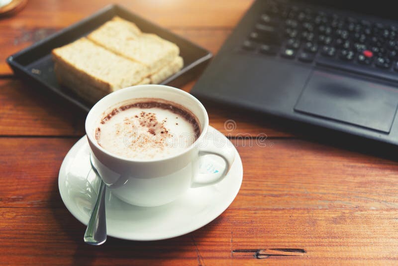Hot Chocolate is Served with Hot Bread between the Notebook. Stock ...
