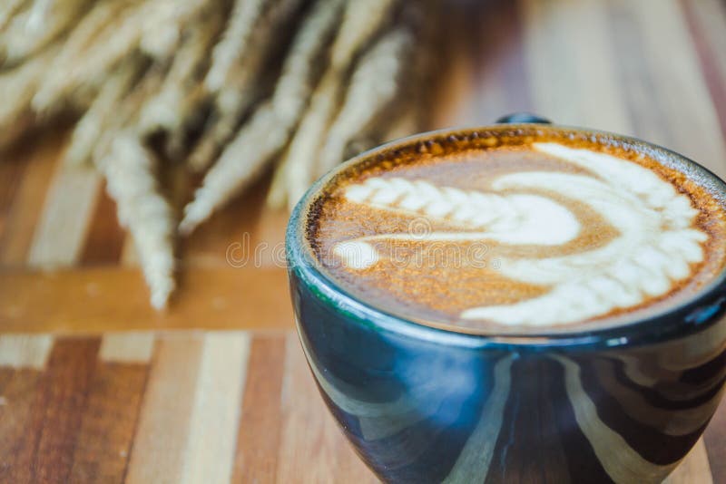 Hot Coffee Filled with Milk is a Art Pattern in the Coffee Shop Stock ...