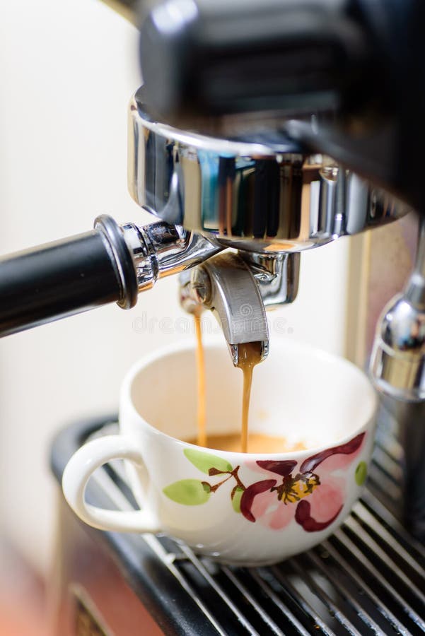 Hot Coffee Flowing into a Cup from Machine Stock Photo - Image of ...