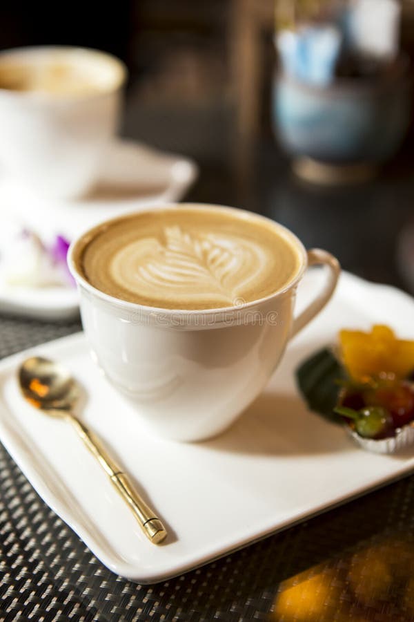 Hot Coffee Late in Clear Coffee Cup Over Blurred Garden Background ...