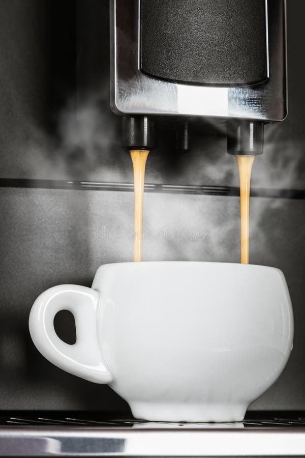 Hot Coffee from the Coffee Machine is Poured into a White Cup Stock ...