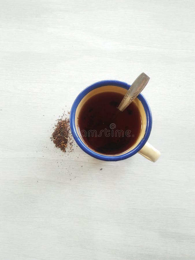 Hot Tea in a Metal Cup with Tea Powder on the Side Stock Photo - Image ...