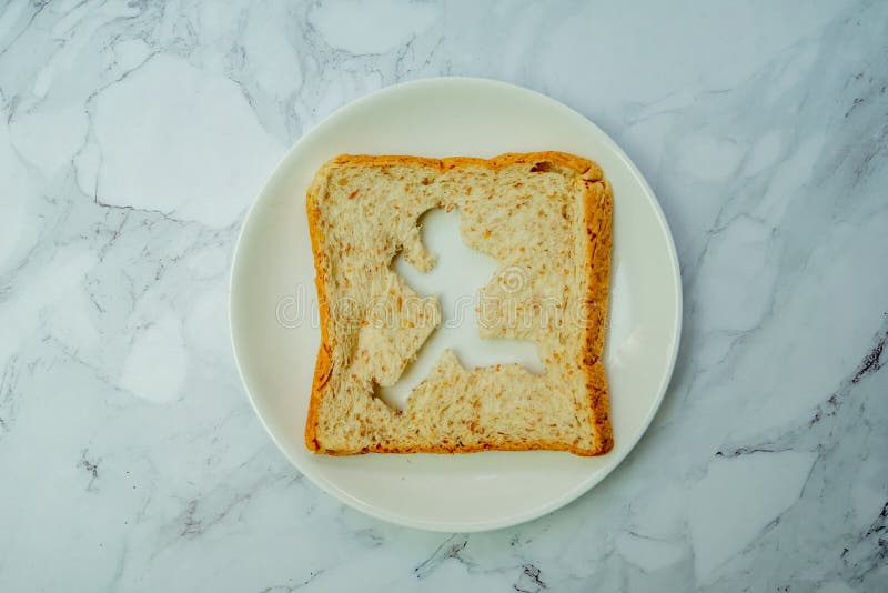 Hot Coffee and Whole Wheat Bread Cut Human Run Shape on Marble B Stock ...