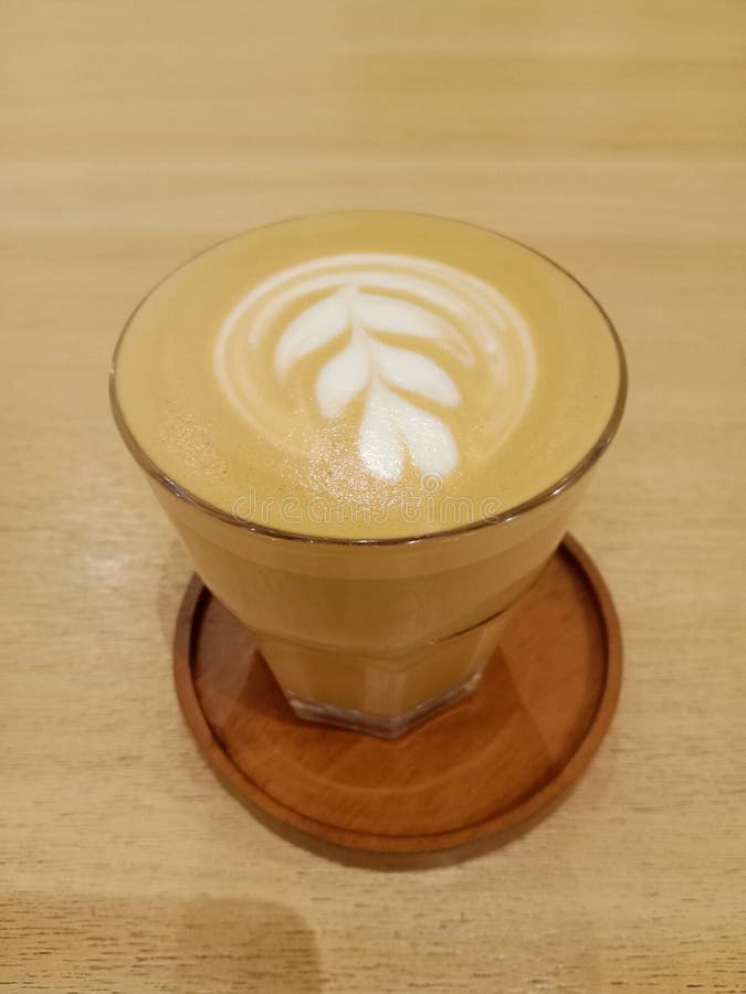 The hot cup of caffe latte stock image. Image of flower - 278368429