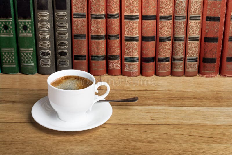 Hot Cup of Fresh Coffee on Wooden Table and a Stack of Books Stock ...