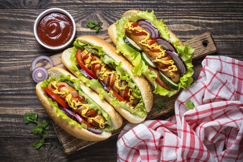 Hot Dog with Fresh Vegetables on Wooden Table. Stock Image - Image of ...