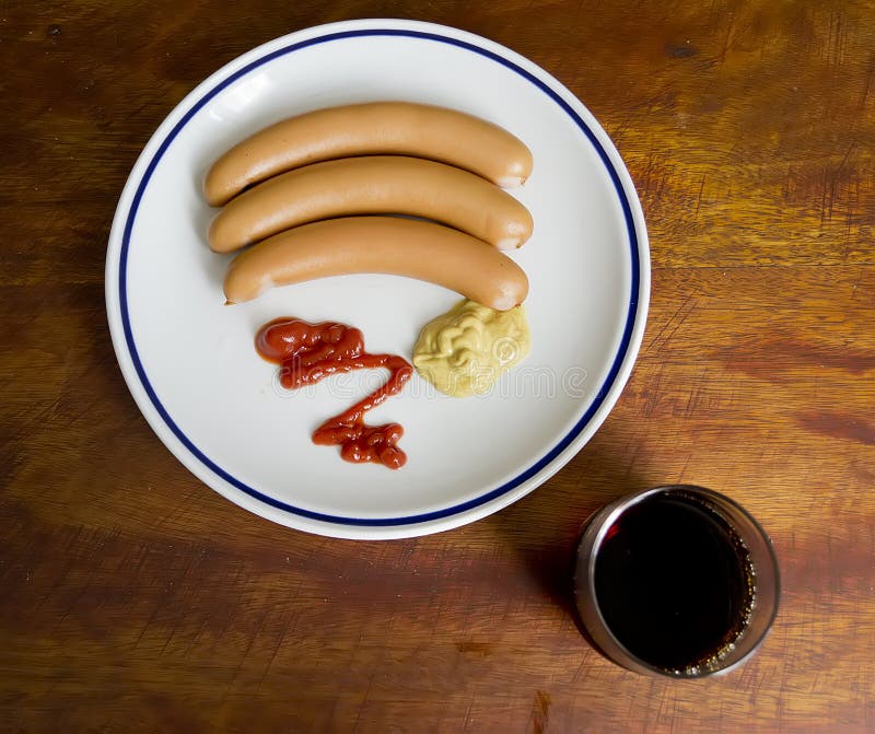 Hot dogs and a cold drink stock image. Image of sauce - 21655393