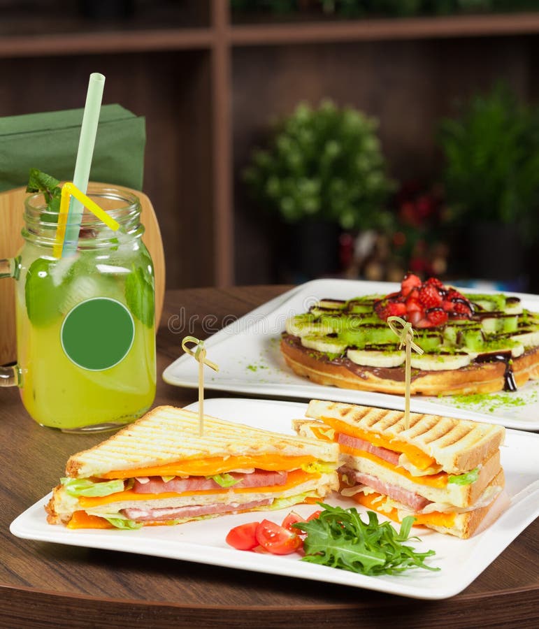 Hot Fresh Toast Sandwich with Ham and Lemonade on Brown Table Stock ...