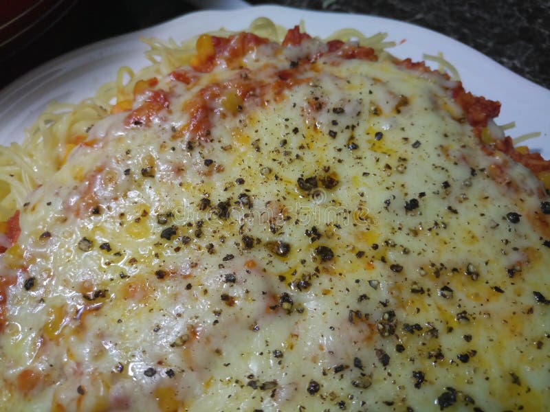 Close Up of Grated Cheddar Cheese Melted on Spaghetti Meal Stock Image ...