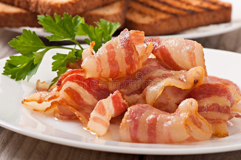 Hot fried bacon stock photo. Image of ingredient, curly - 318568952