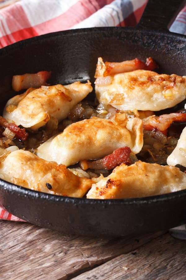 Hot Fried Dumplings with Bacon and Onions in a Pan, Vertical Stock ...