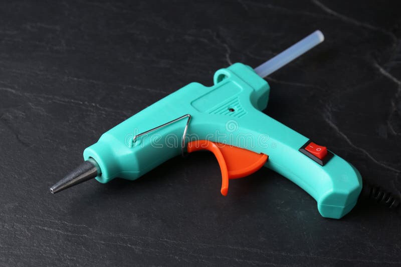 Hot Glue Gun with Stick on Grey Table Stock Image - Image of grey ...
