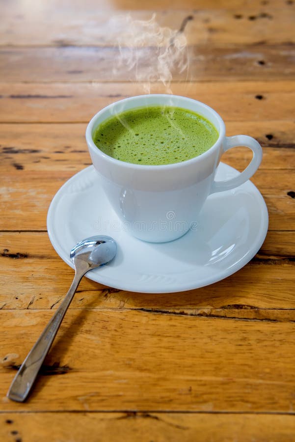 Hot green tea on the table stock photo. Image of cold - 85273788