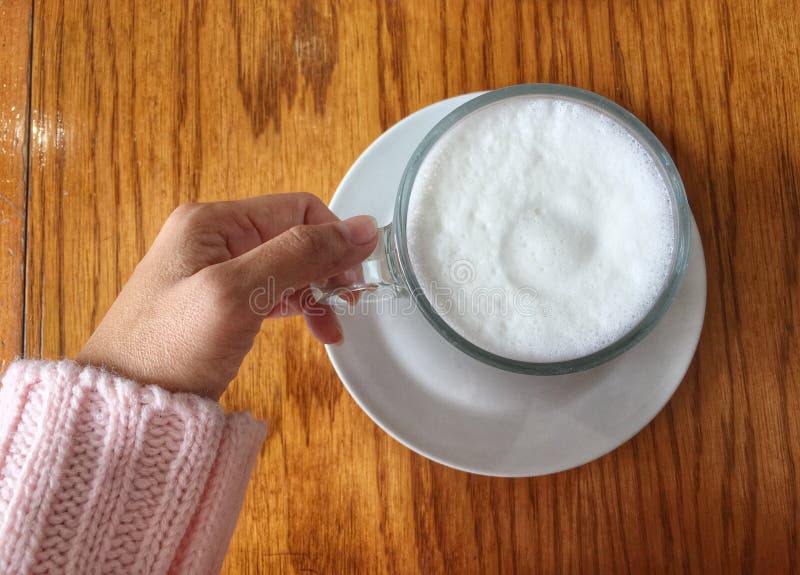Hot Milk in a Cold Day stock image. Image of woodentable - 131677091