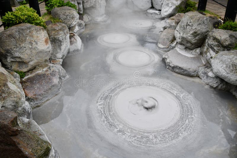 Hot mud puddle is boiling stock photo. Image of waterfall - 380628910