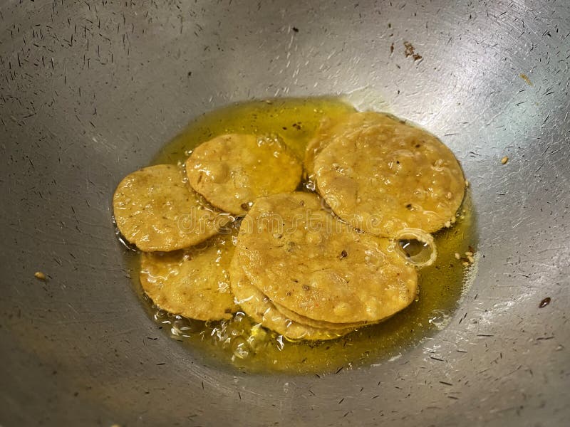 Hot Oil Inside a Deep Pan, Their Surfaces Bubbling As they Turn Golden ...