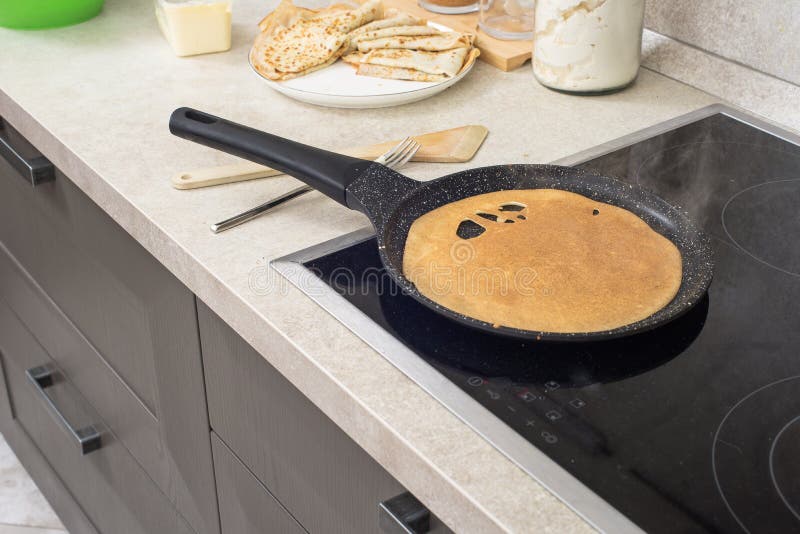 Hot Pancake in a Pan on a Hot Stove in the Kitchen Stock Photo - Image ...