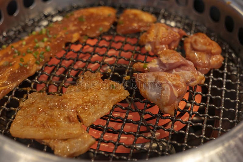 Hot Pork and Chicken Grill on Stove. Stock Image - Image of grill, meat ...