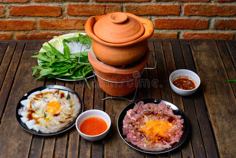 Hot Pot with Clear Soup in the Clay Cooking Pot. Stock Photo - Image of ...