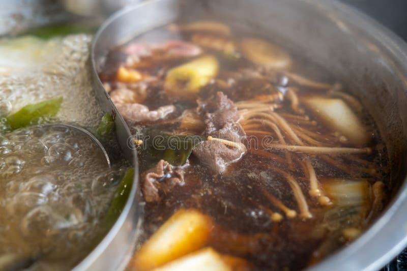 Hot Pot with Two Types of Soup, Clear and Shabu Soup. Stock Image ...