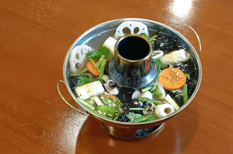 Hot Pot with Vegetables on Wooden Table, High Angle View Stock Image ...