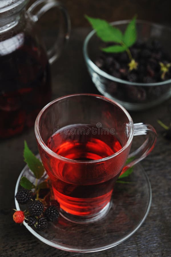 Hot Raspberry Tea and Black Raspberries in Glass Bowl Stock Image ...
