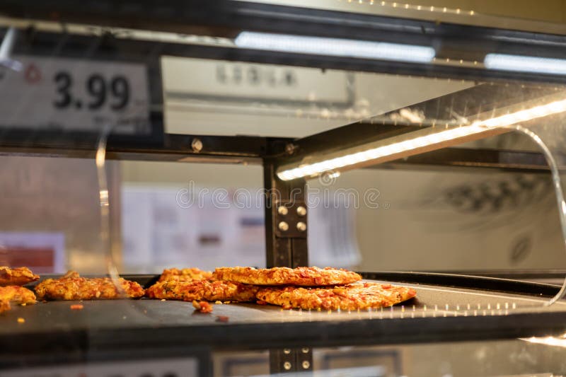 Hot and Ready Small Rectangular Pizzas Displayed in a Heated Retail ...