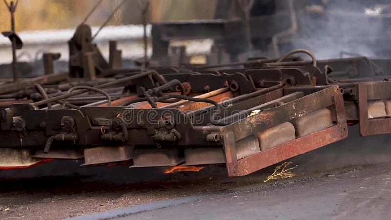 Hot Recycling Machines Running on the Road. Smoke Around Machines Stock ...