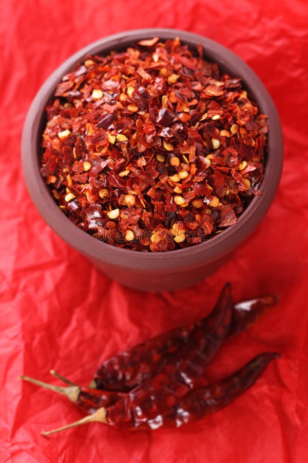 Hot Red Chilli Chillies Crushed Pepper on Red Stock Image - Image of ...