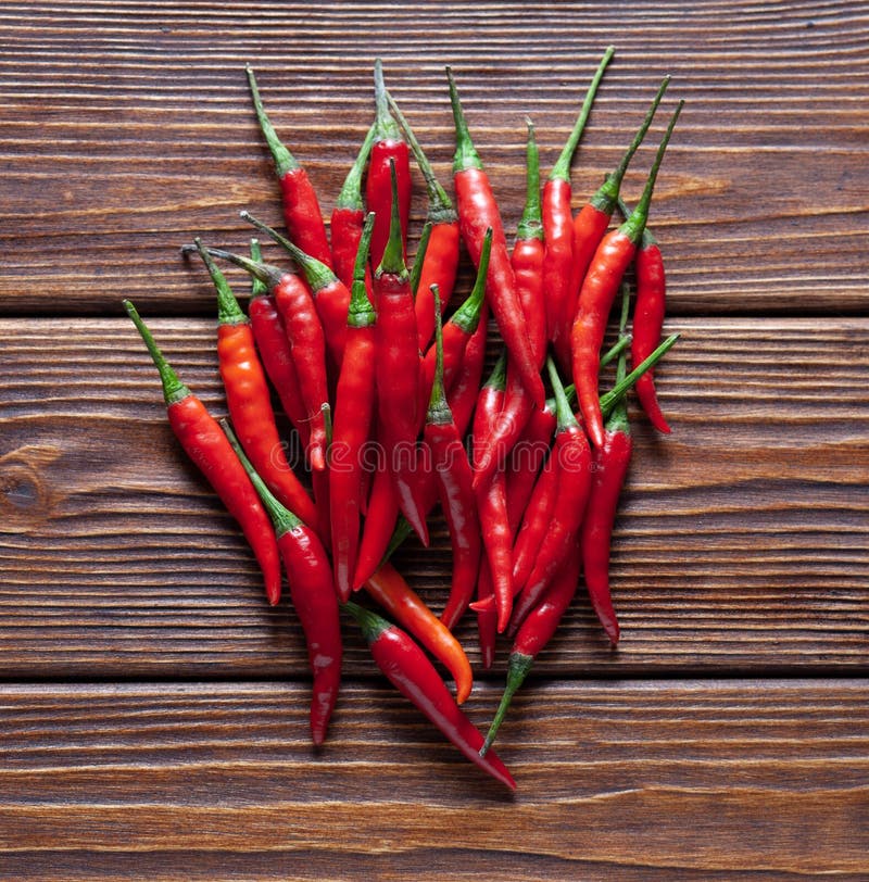 Hot Red Chilli Pepper in Pods on Wooden Table Stock Photo - Image of ...