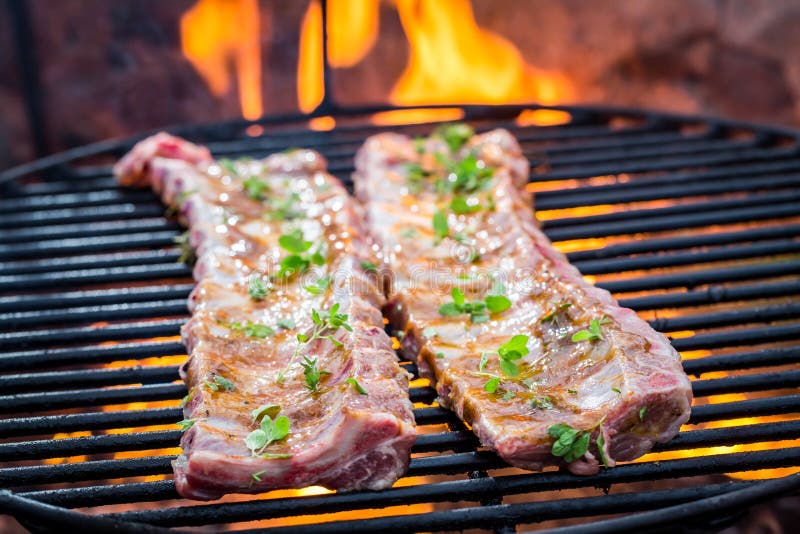 Hot Ribs on Grill with Thyme and Spices Stock Photo - Image of barbecue ...