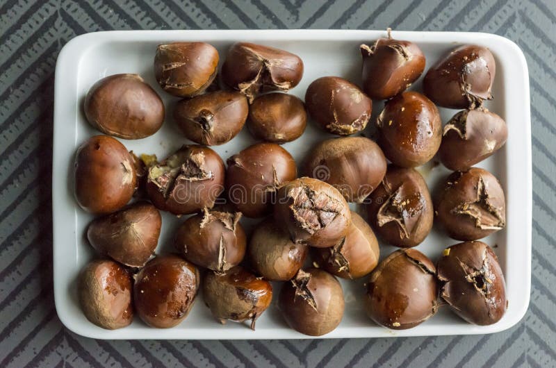 Hot roasted chestnuts stock photo. Image of snack, open - 110821936