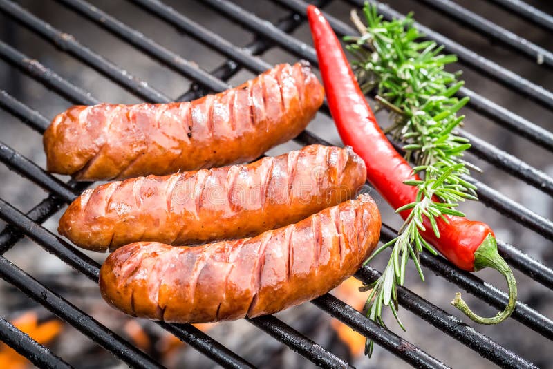 Hot Sausage on the Grill with Chilli and Rosemary Stock Photo - Image ...