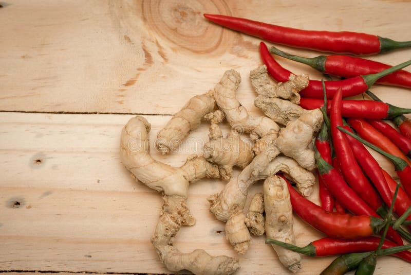 Hot and Spicy Red Chilli on Wood Table Background Stock Photo - Image ...