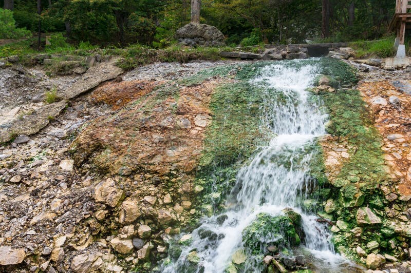 Hot Spring Running through Rocks. Hot Spring Mineral Water Waterfall ...